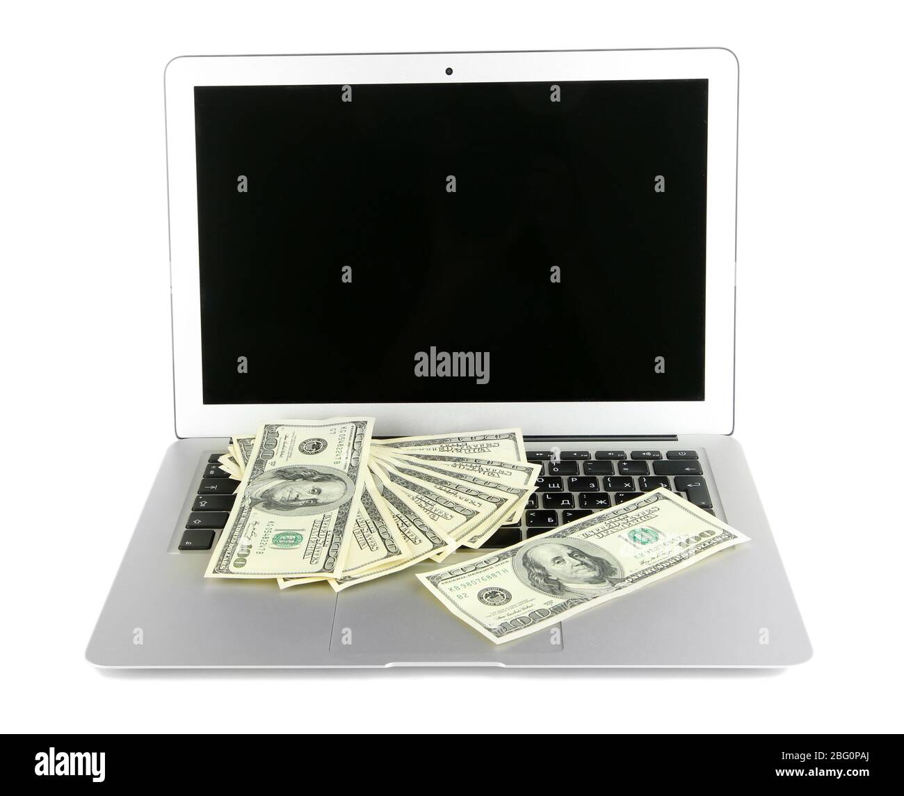 Money on laptop isolated on white Stock Photo - Alamy