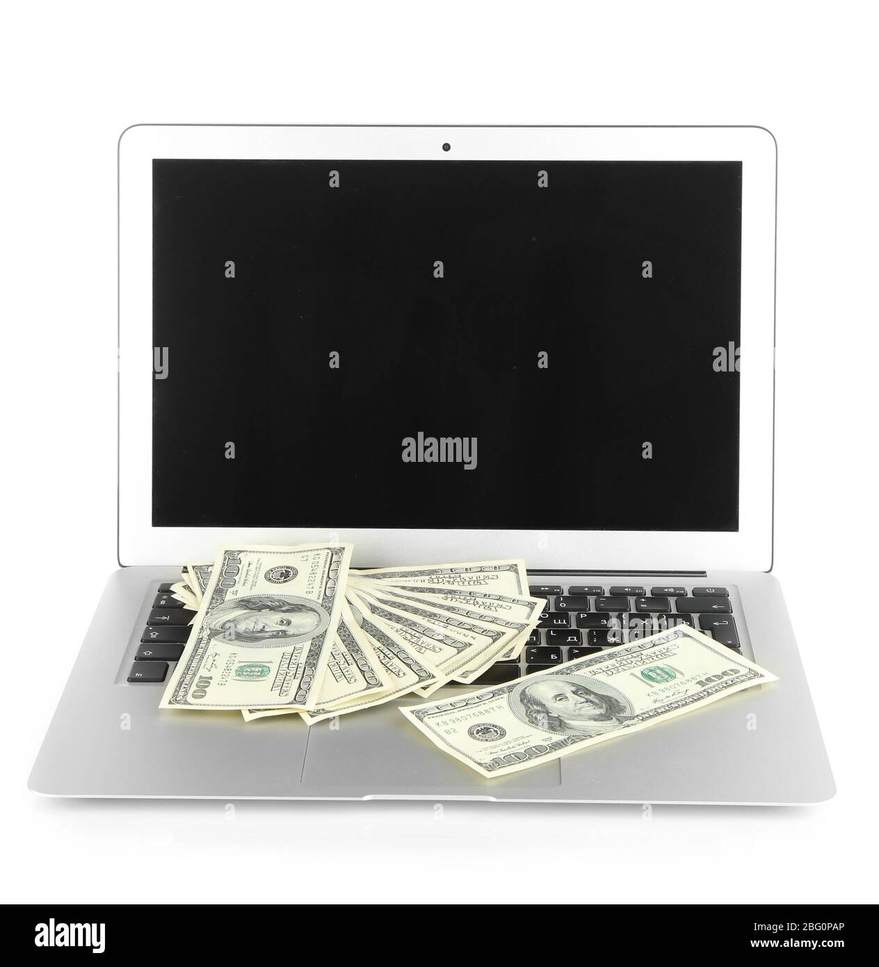 Money on laptop isolated on white Stock Photo - Alamy