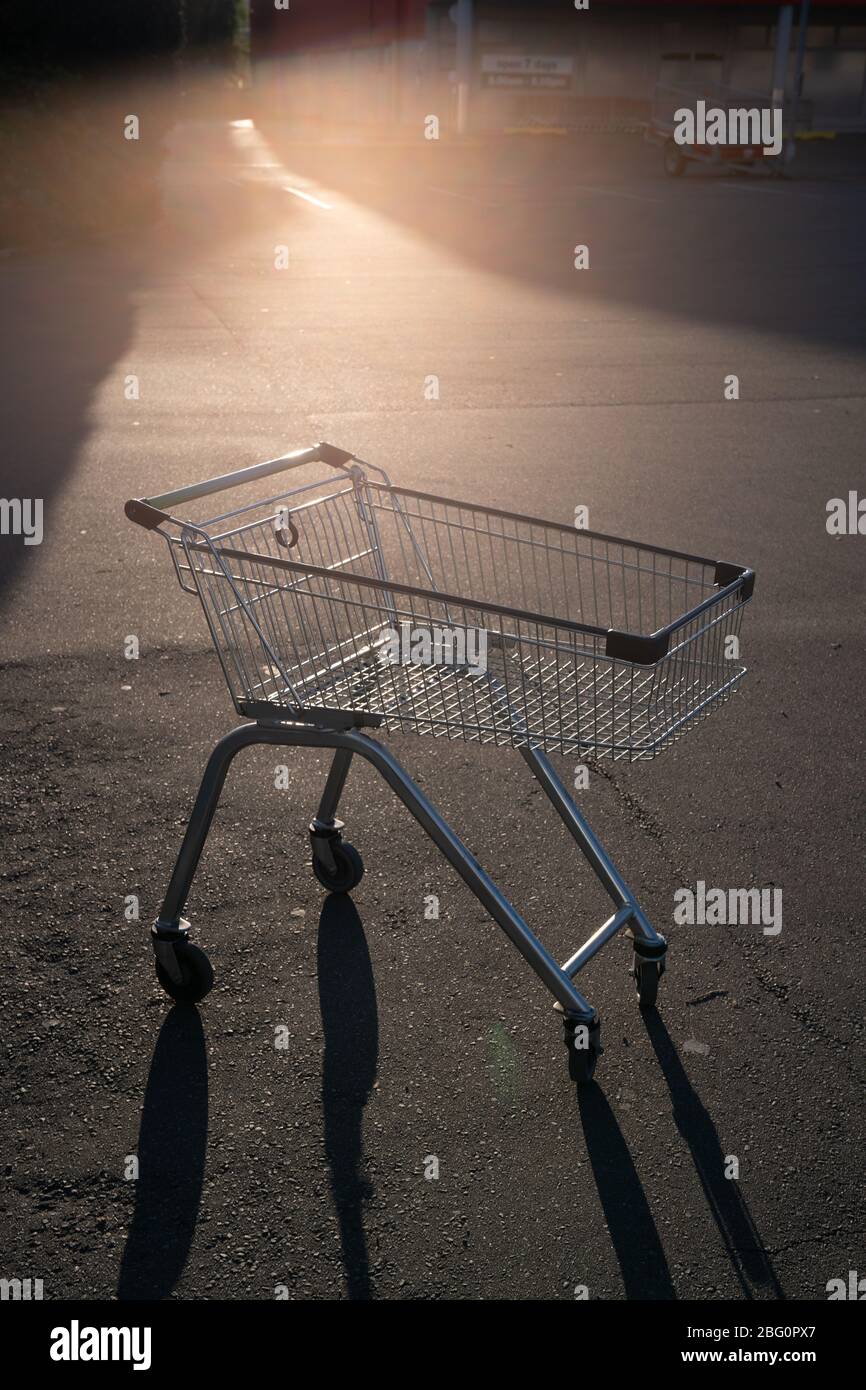 The trolley parking on the street at car park during sunset Stock Photo ...