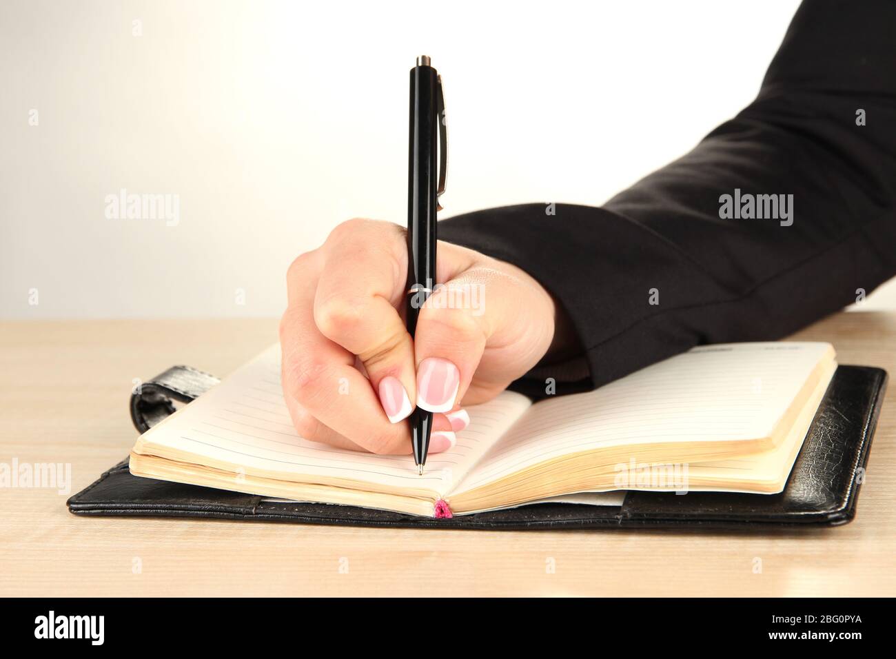 Hand write on notebook, on white background Stock Photo - Alamy