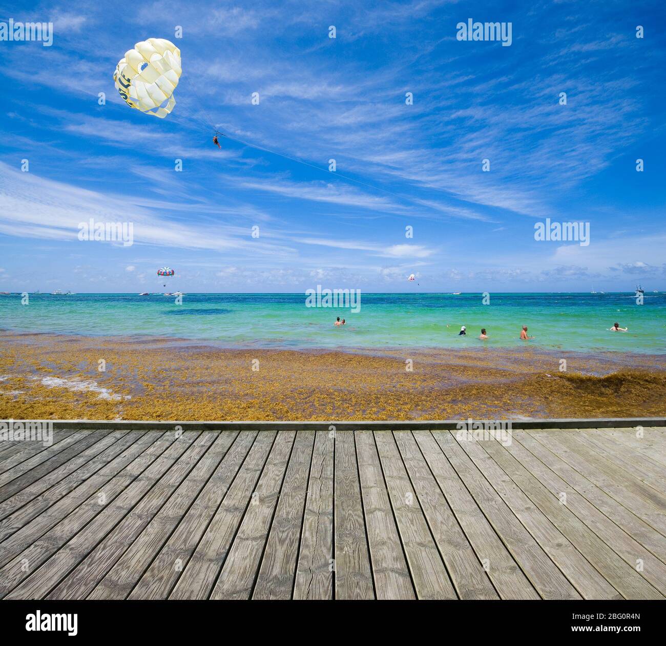 Empty wooden platform beside tropical beach at Punta Cana, Dominican ...