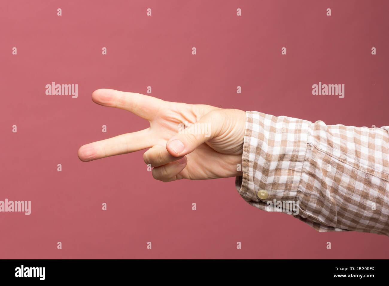 The perfection of an adult hand, with all five fingers, making signs ...