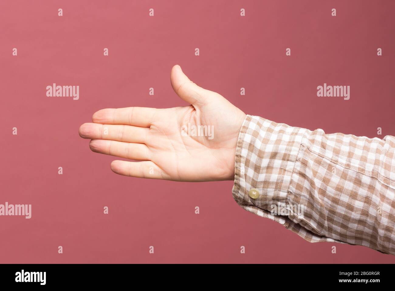 The perfection of an adult hand, with all five fingers, making signs ...