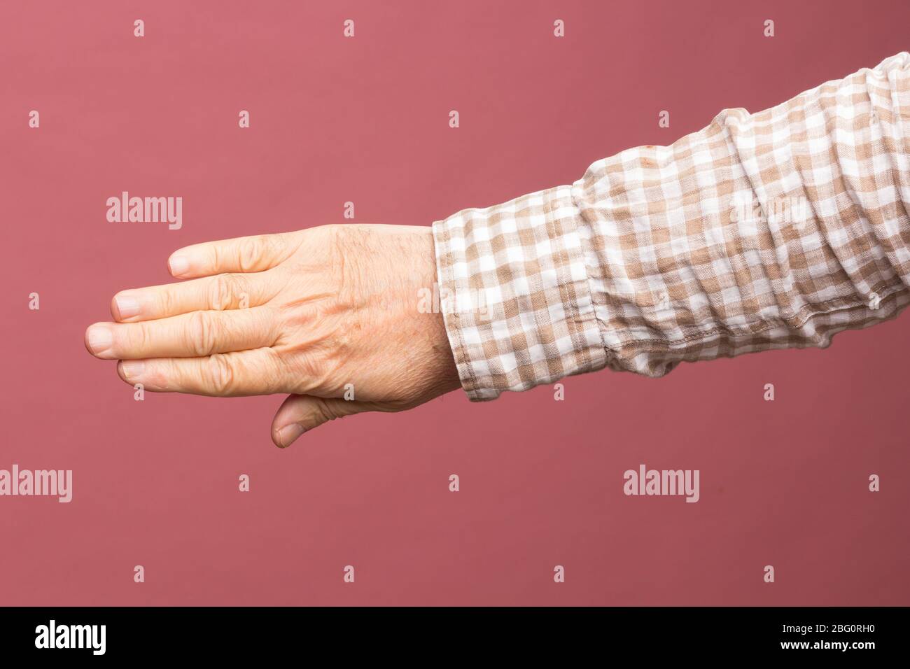 The perfection of an adult hand, with all five fingers, making signs ...