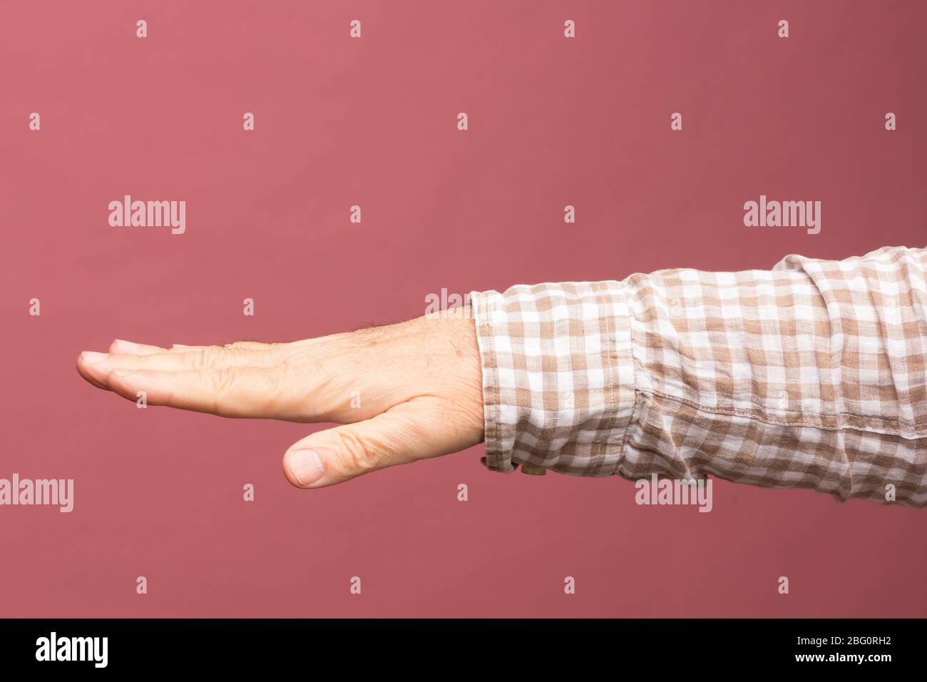 The perfection of an adult hand, with all five fingers, making signs ...