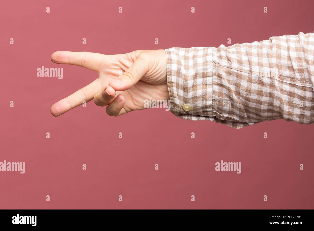 The perfection of an adult hand, with all five fingers, making signs ...