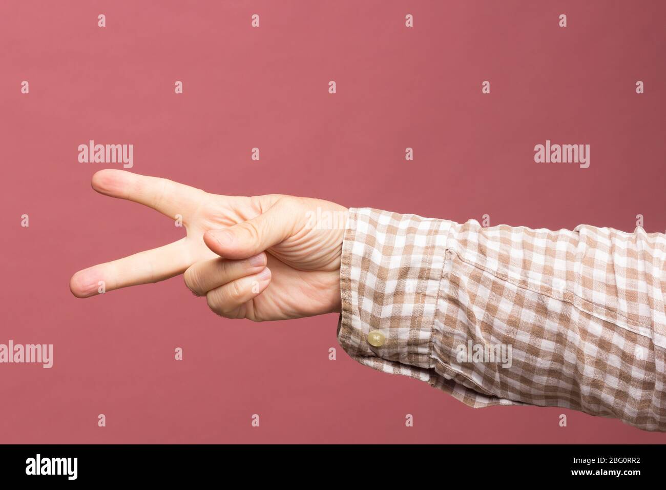 The perfection of an adult hand, with all five fingers, making signs ...