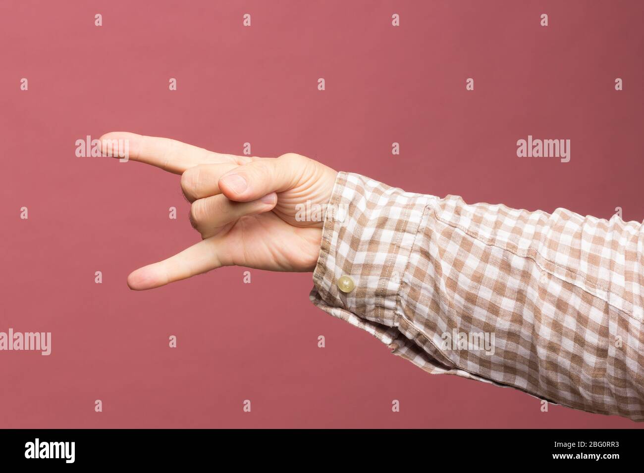 The perfection of an adult hand, with all five fingers, making signs ...