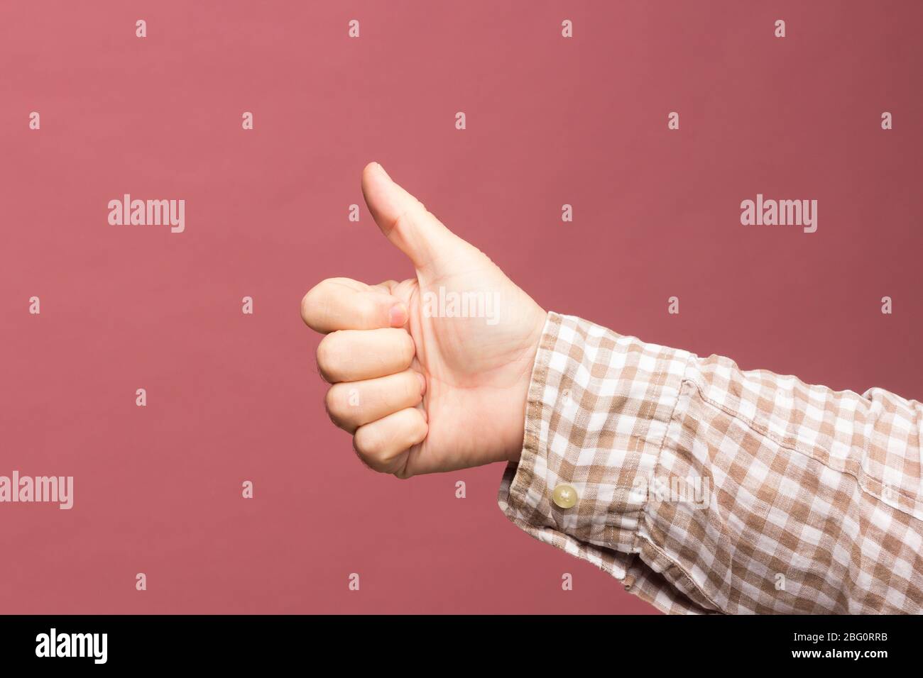 The perfection of an adult hand, with all five fingers, making signs ...