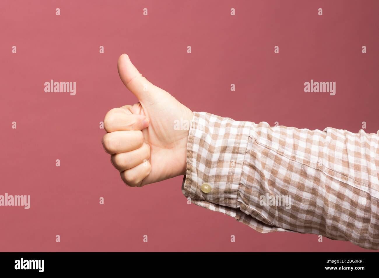 The perfection of an adult hand, with all five fingers, making signs ...