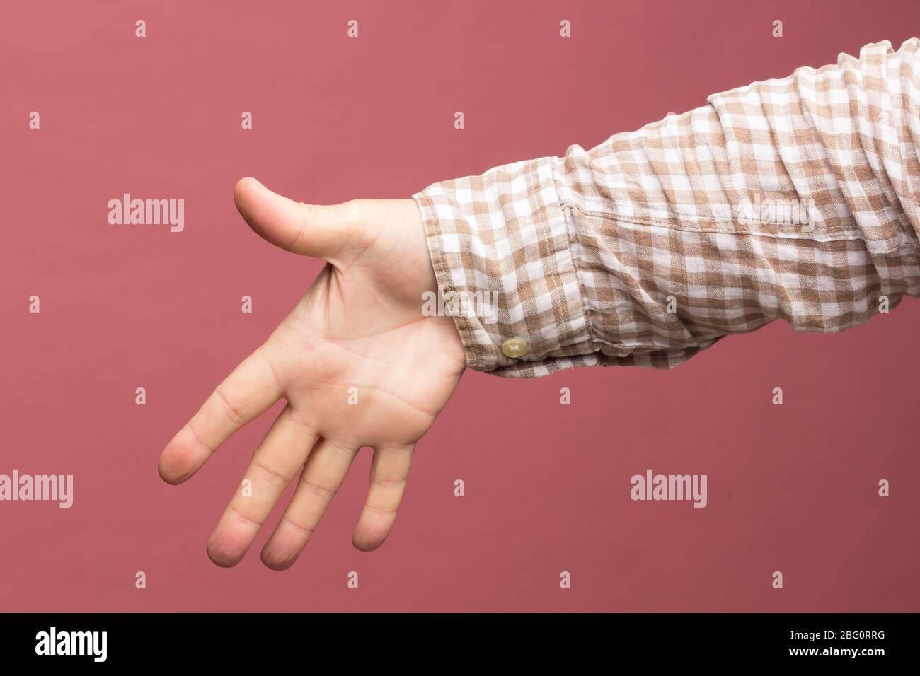 The perfection of an adult hand, with all five fingers, making signs ...