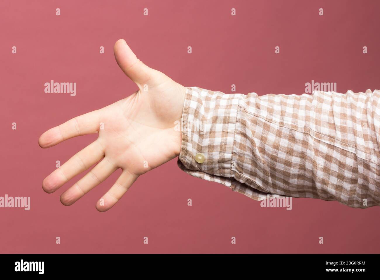 The perfection of an adult hand, with all five fingers, making signs ...