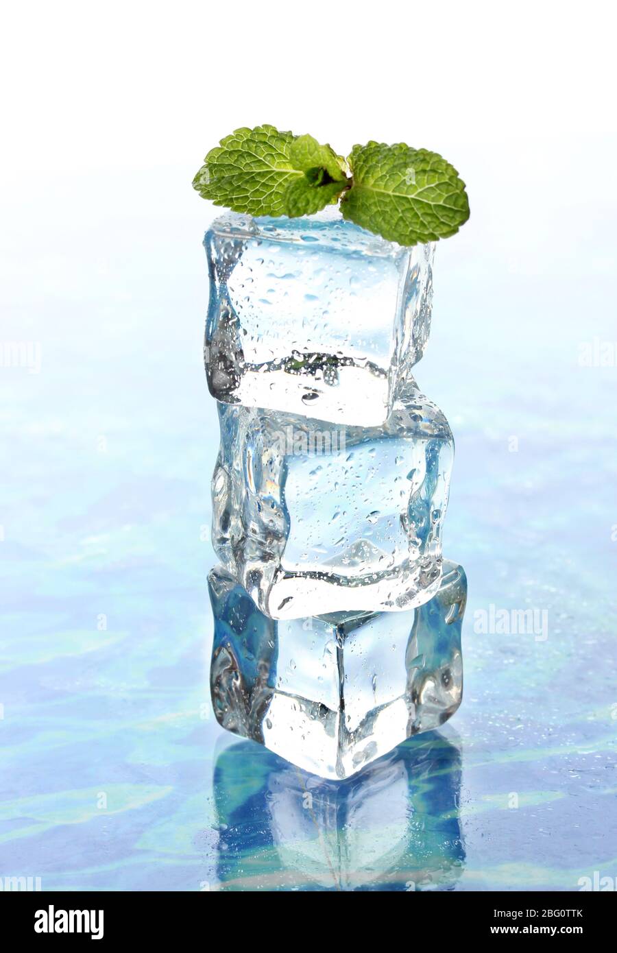 Ice with mint on light background Stock Photo - Alamy