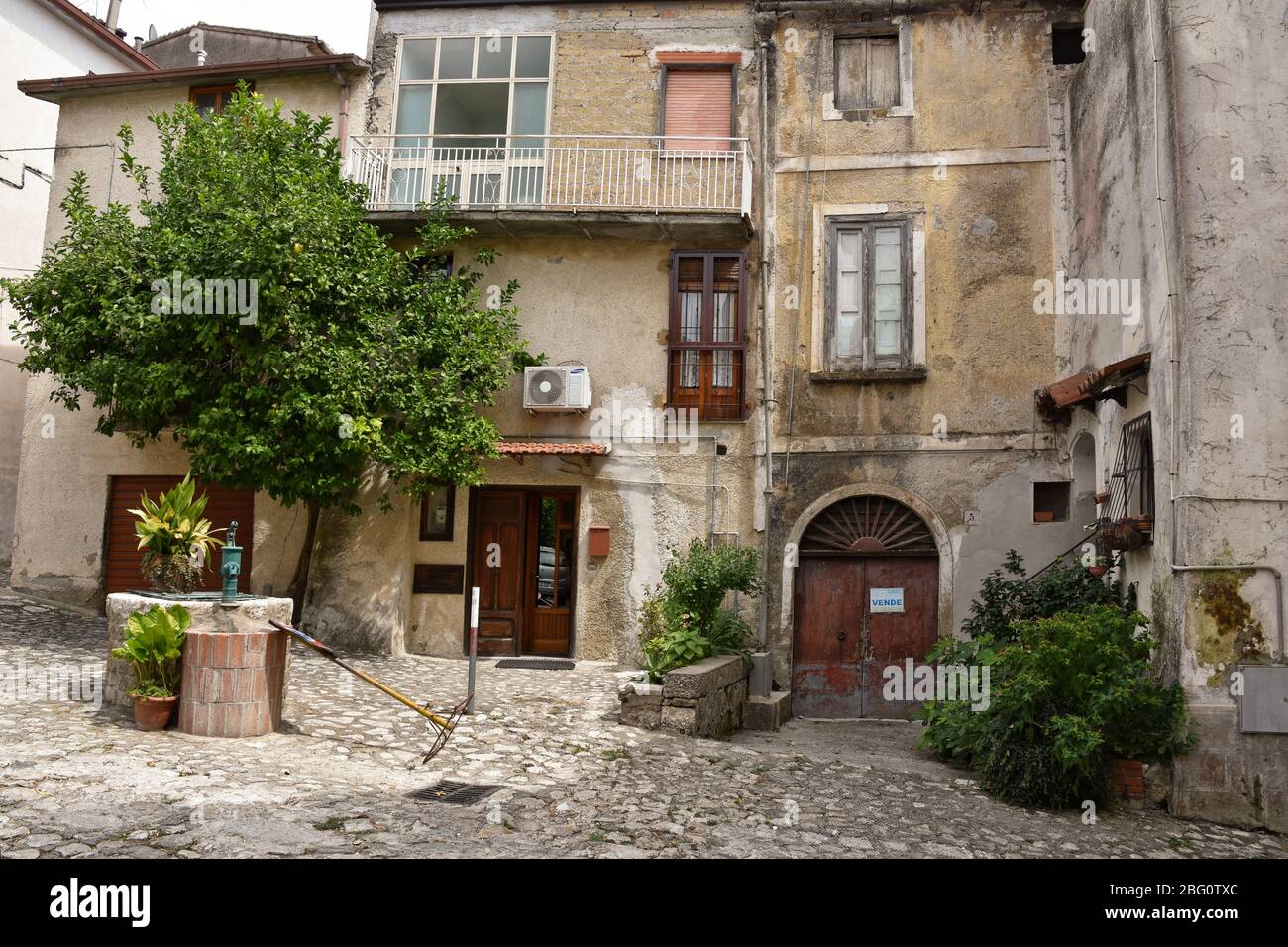 A narrow street among the old houses of the medieval village of Caiazzo ...