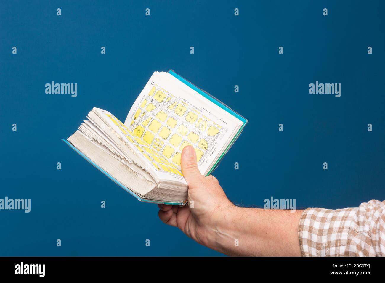 Book with the streets of a city and the maps of the city in correlative ...