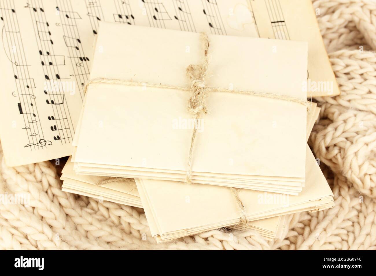 Stacks of old letters and music sheets on soft scarf Stock Photo - Alamy