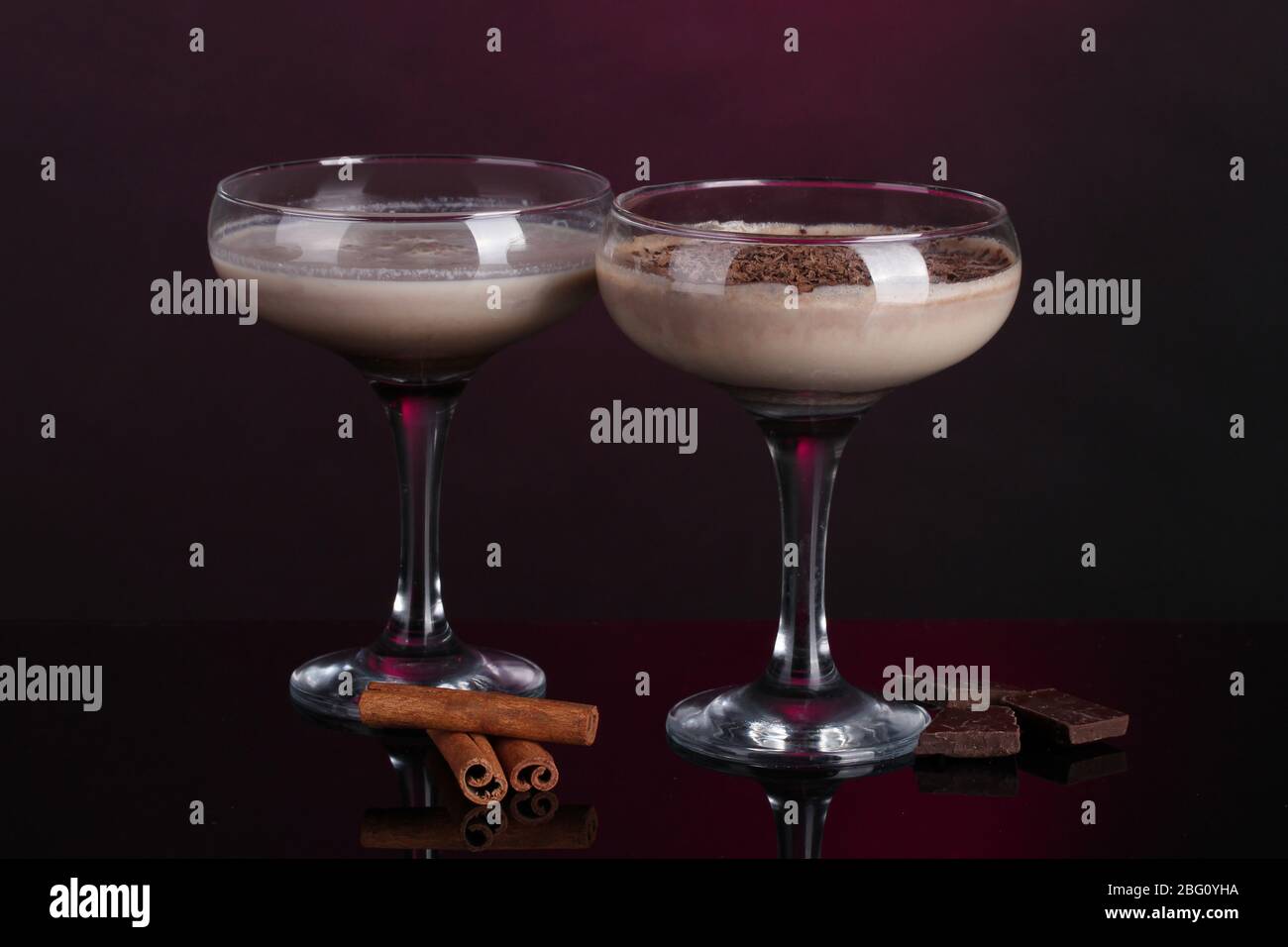 Cream cocktails on dark purple background Stock Photo - Alamy