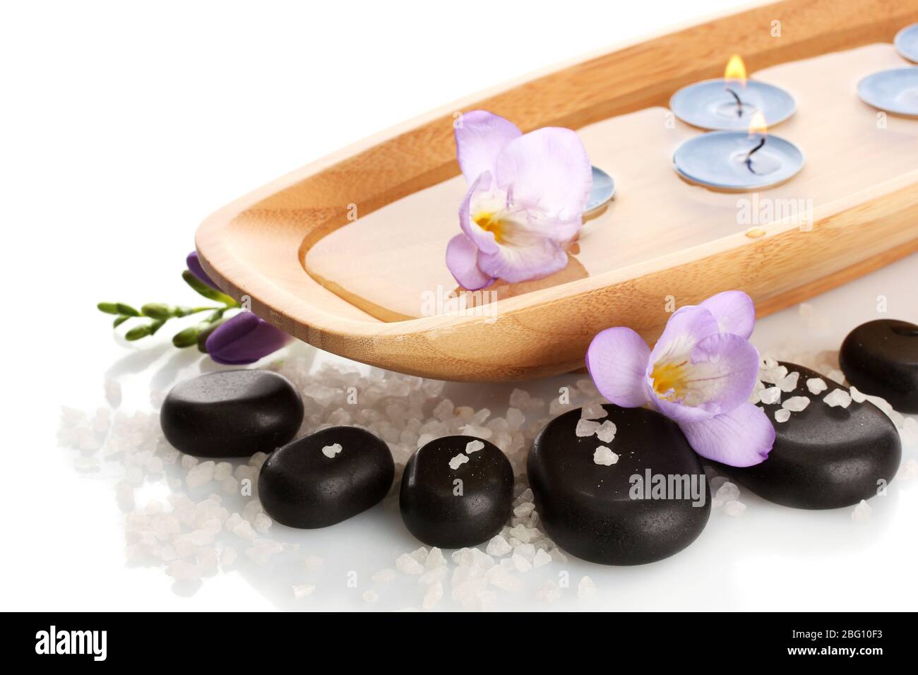 Beautiful spa setting with flowers, isolated on white Stock Photo - Alamy