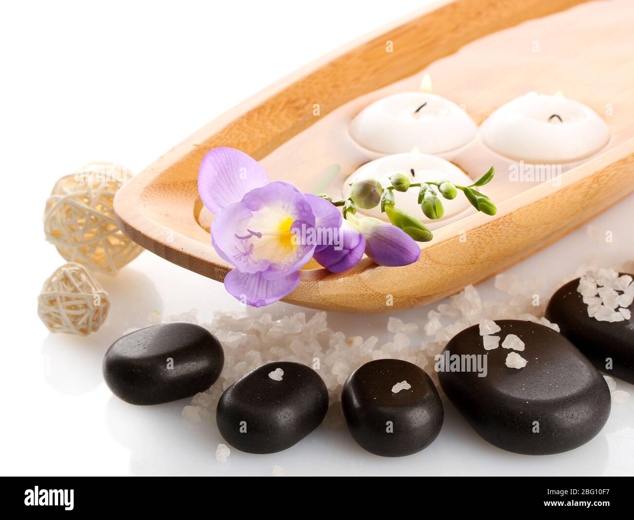 Beautiful spa setting with flowers, isolated on white Stock Photo - Alamy