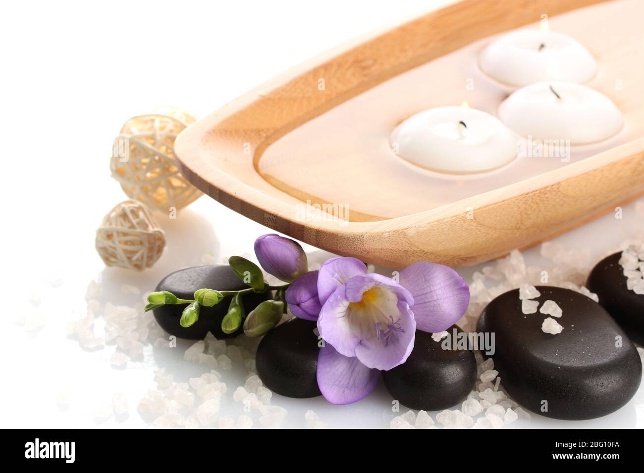 Beautiful spa setting with flowers, isolated on white Stock Photo - Alamy