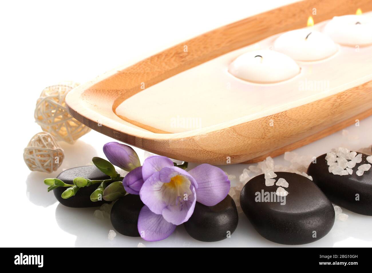 Beautiful spa setting with flowers, isolated on white Stock Photo - Alamy