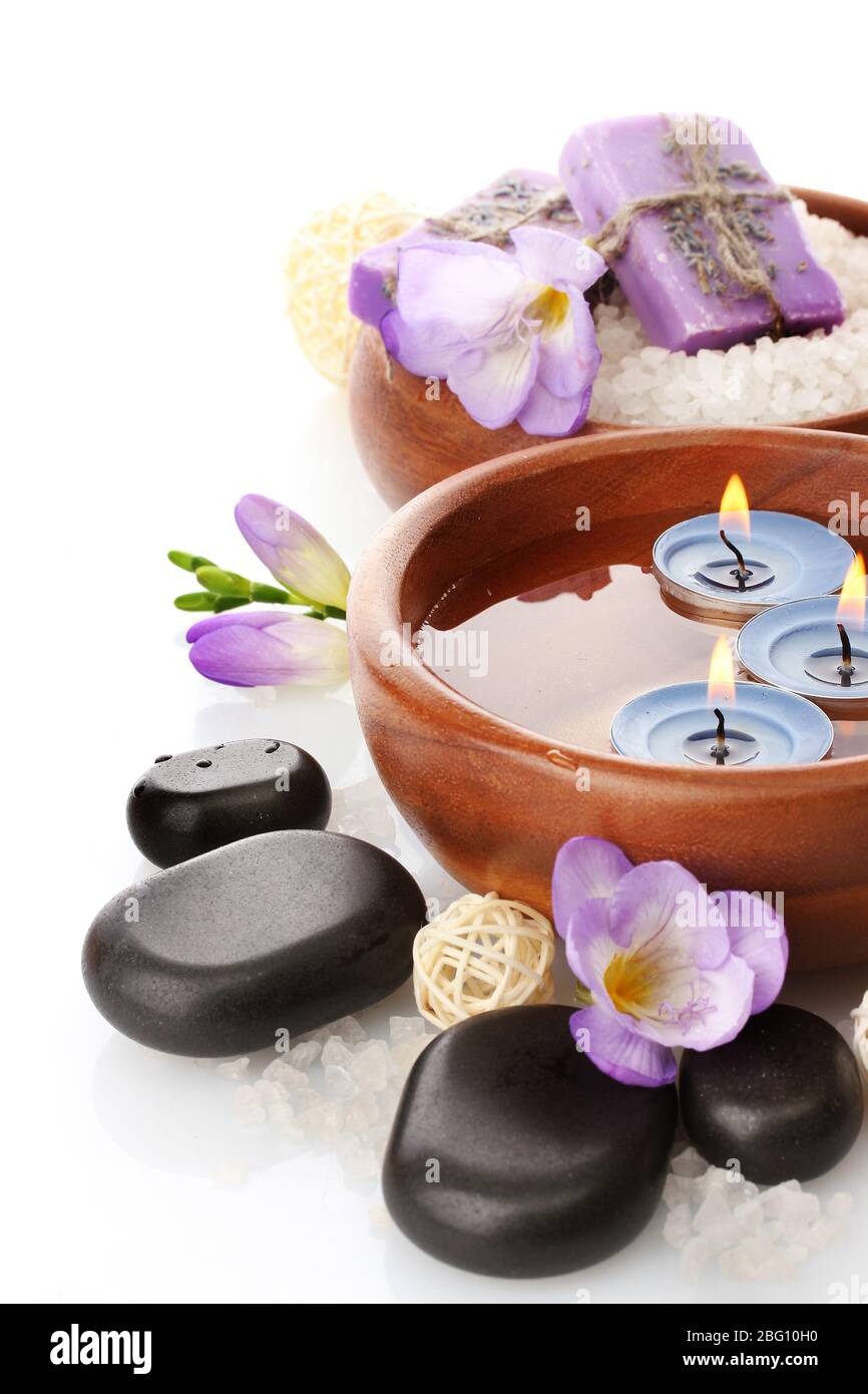 Beautiful spa setting with flowers, isolated on white Stock Photo - Alamy