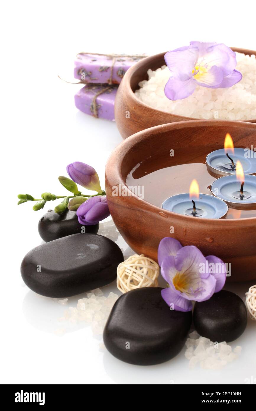 Beautiful spa setting with flowers, isolated on white Stock Photo - Alamy