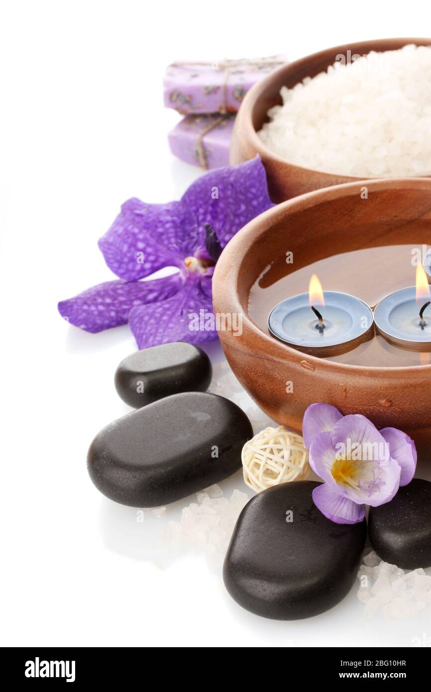 Beautiful spa setting with flowers, isolated on white Stock Photo - Alamy