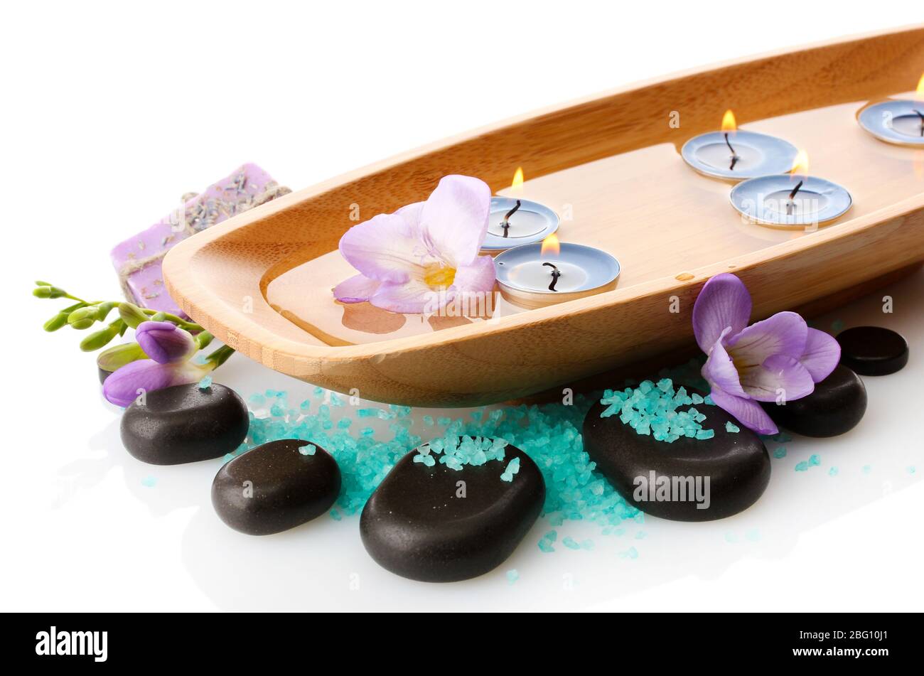 Beautiful spa setting with flowers, isolated on white Stock Photo - Alamy