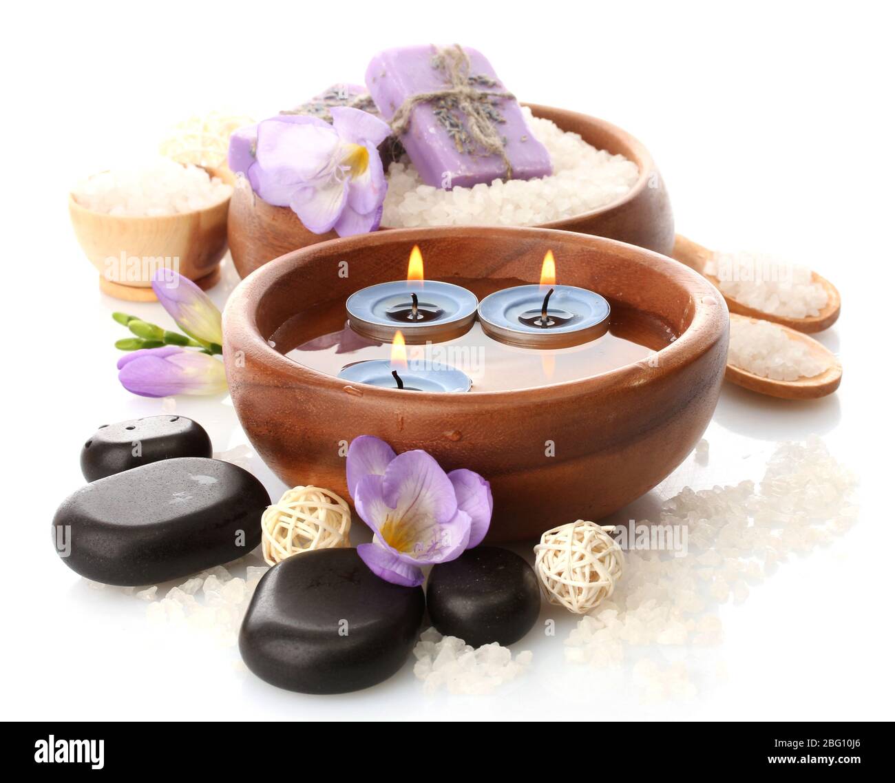 Beautiful spa setting with flowers, isolated on white Stock Photo - Alamy
