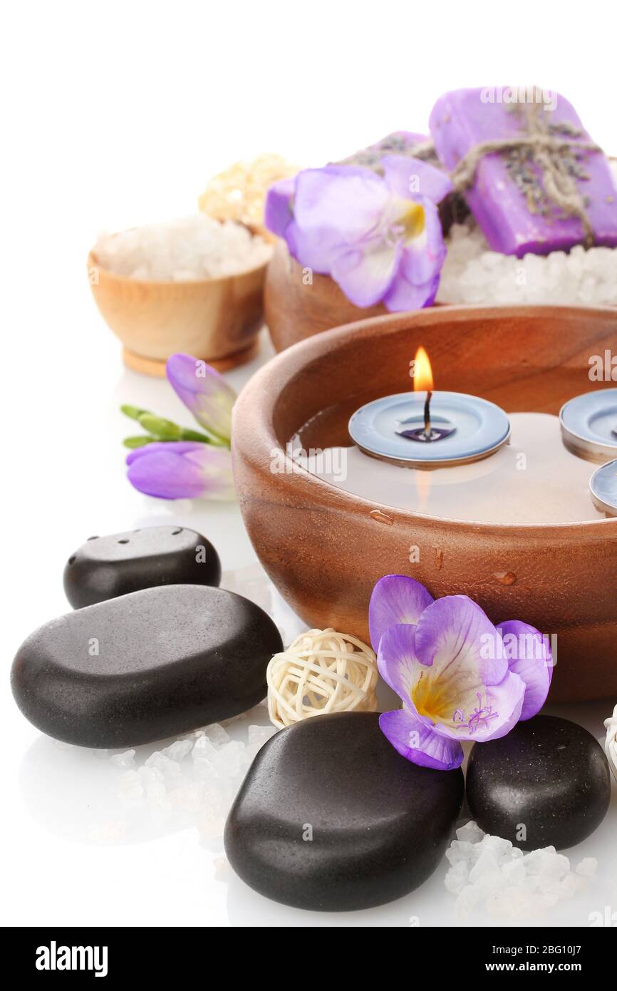 Beautiful spa setting with flowers, isolated on white Stock Photo - Alamy
