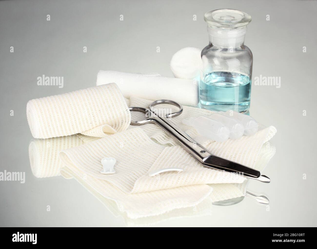 First aid kit for bandaging on grey background Stock Photo - Alamy