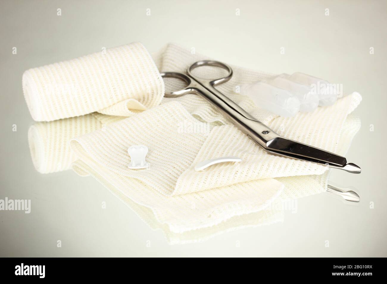 First aid kit for bandaging on grey background Stock Photo - Alamy