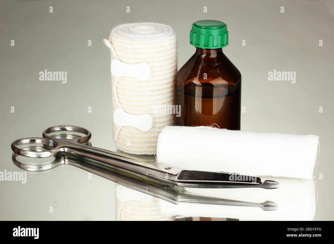 First aid kit for bandaging on grey background Stock Photo - Alamy