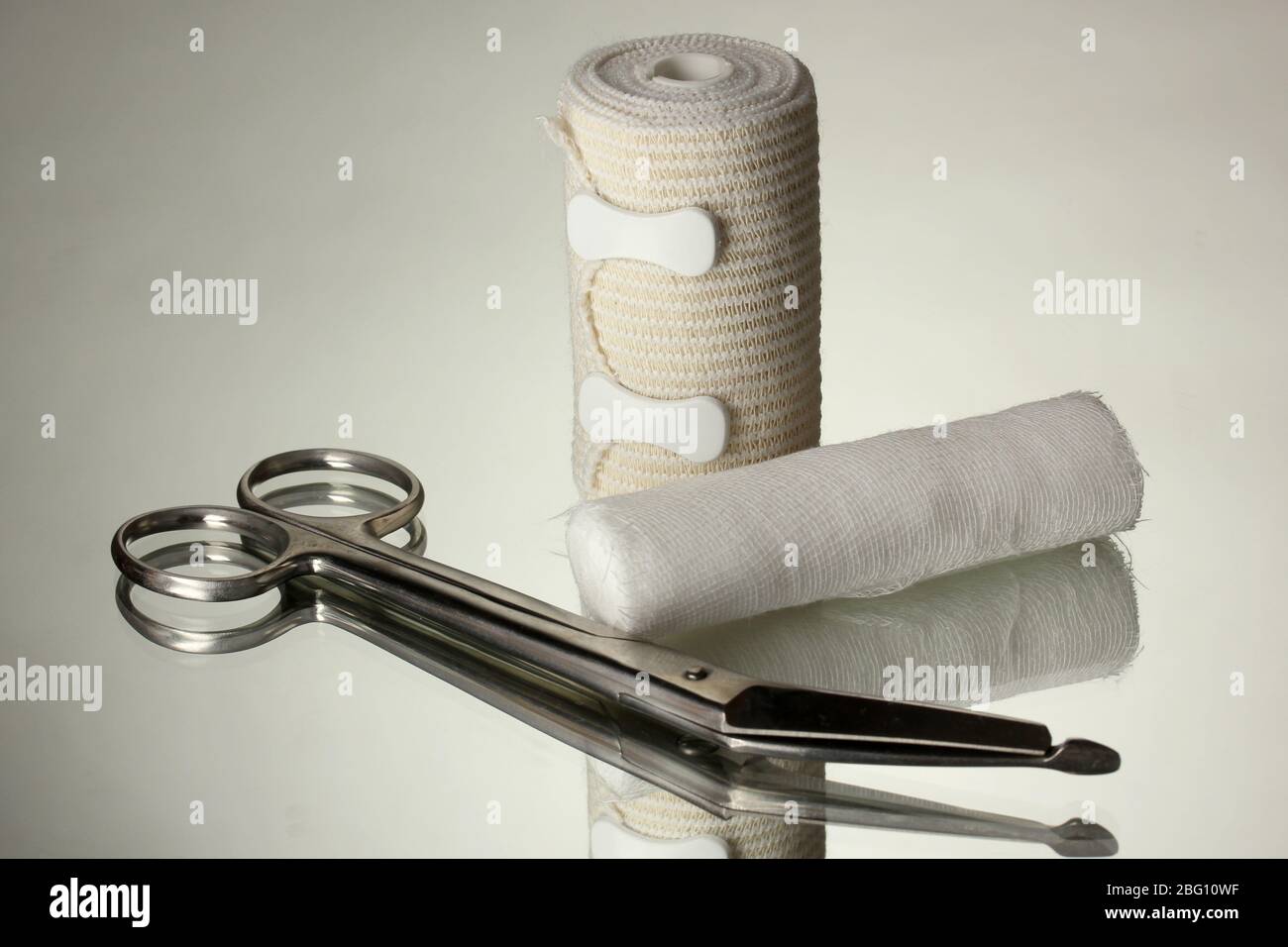 First aid kit for bandaging on grey background Stock Photo - Alamy