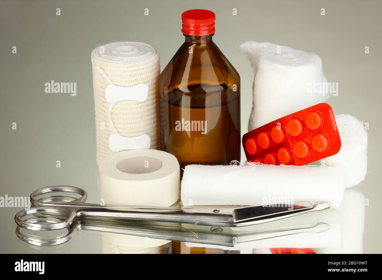 First aid kit for bandaging on grey background Stock Photo - Alamy