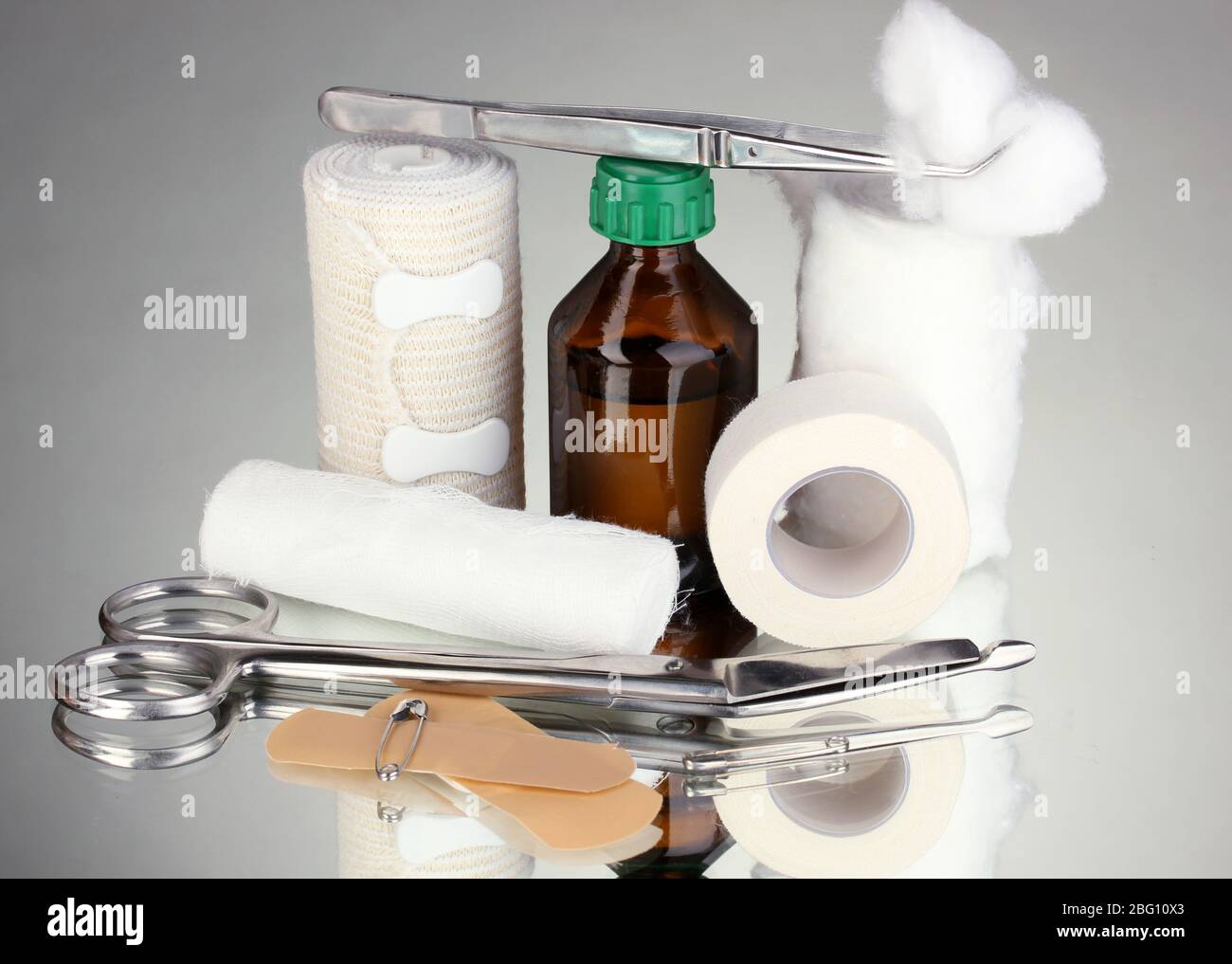 First aid kit for bandaging on grey background Stock Photo - Alamy