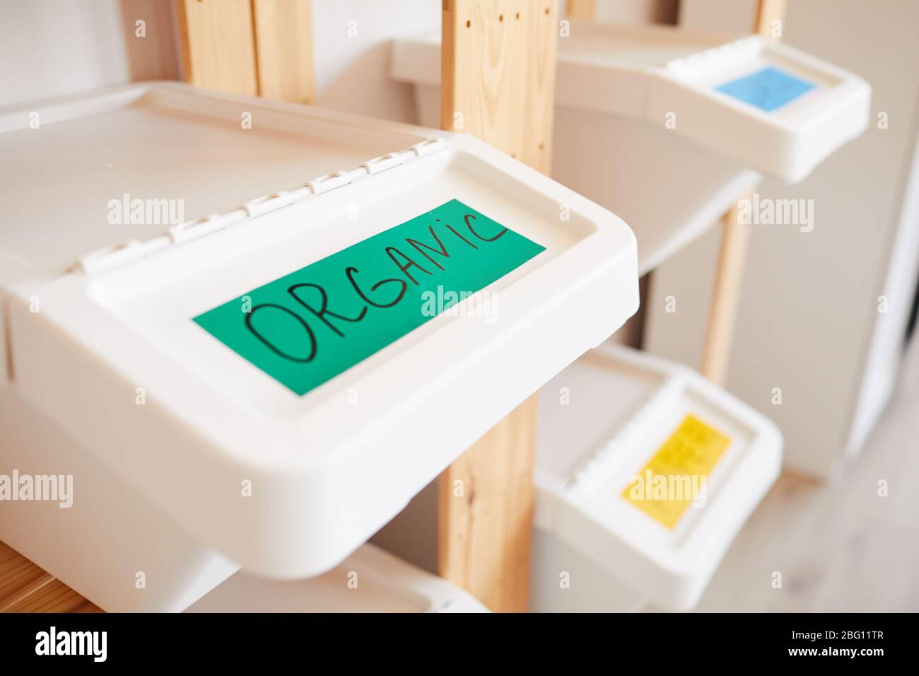 Close up background image of plastic bin labeled for organic waste ...