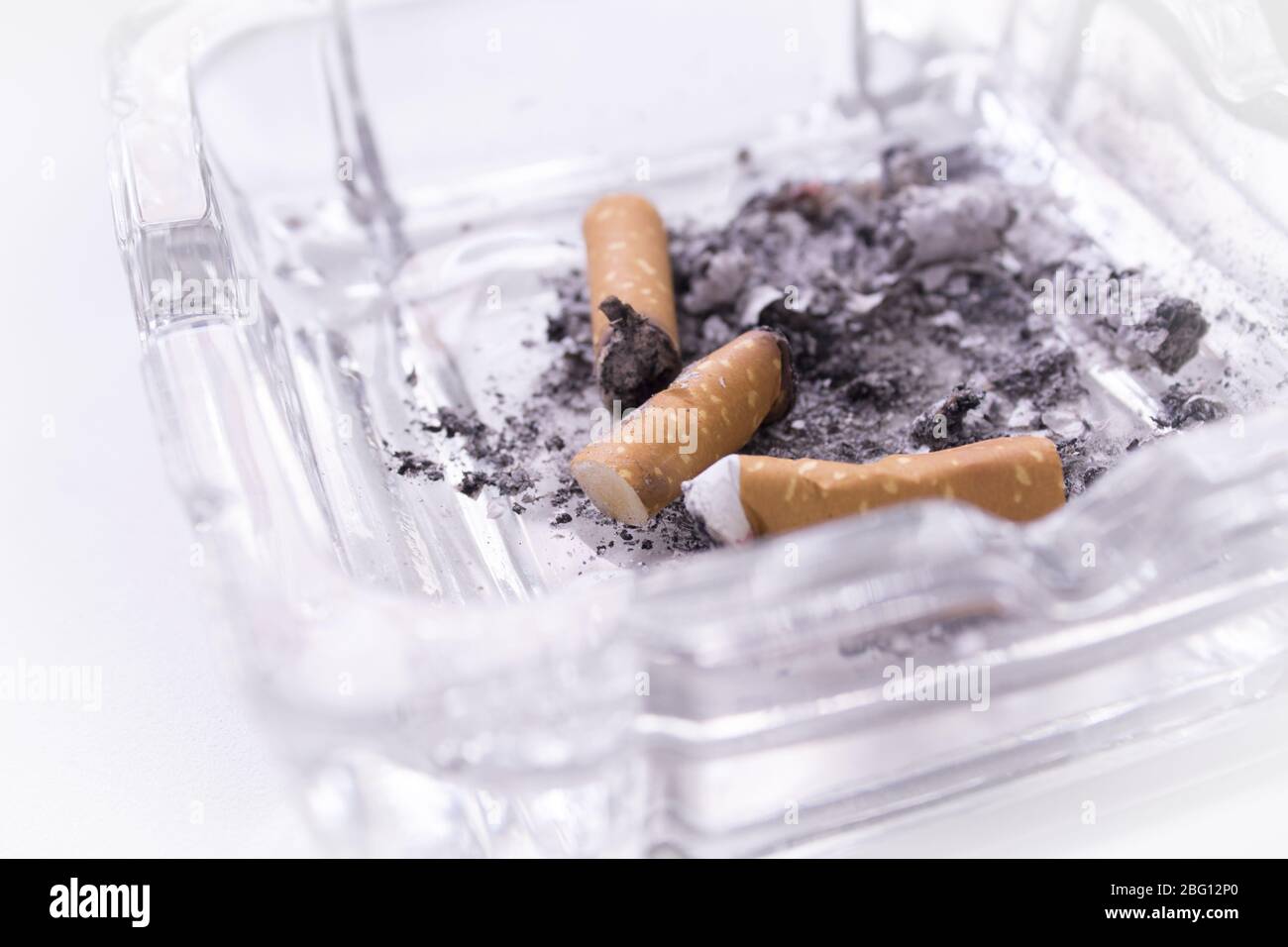 Ashtray with several cigarettes consumed and extinguished. Cigarette ...
