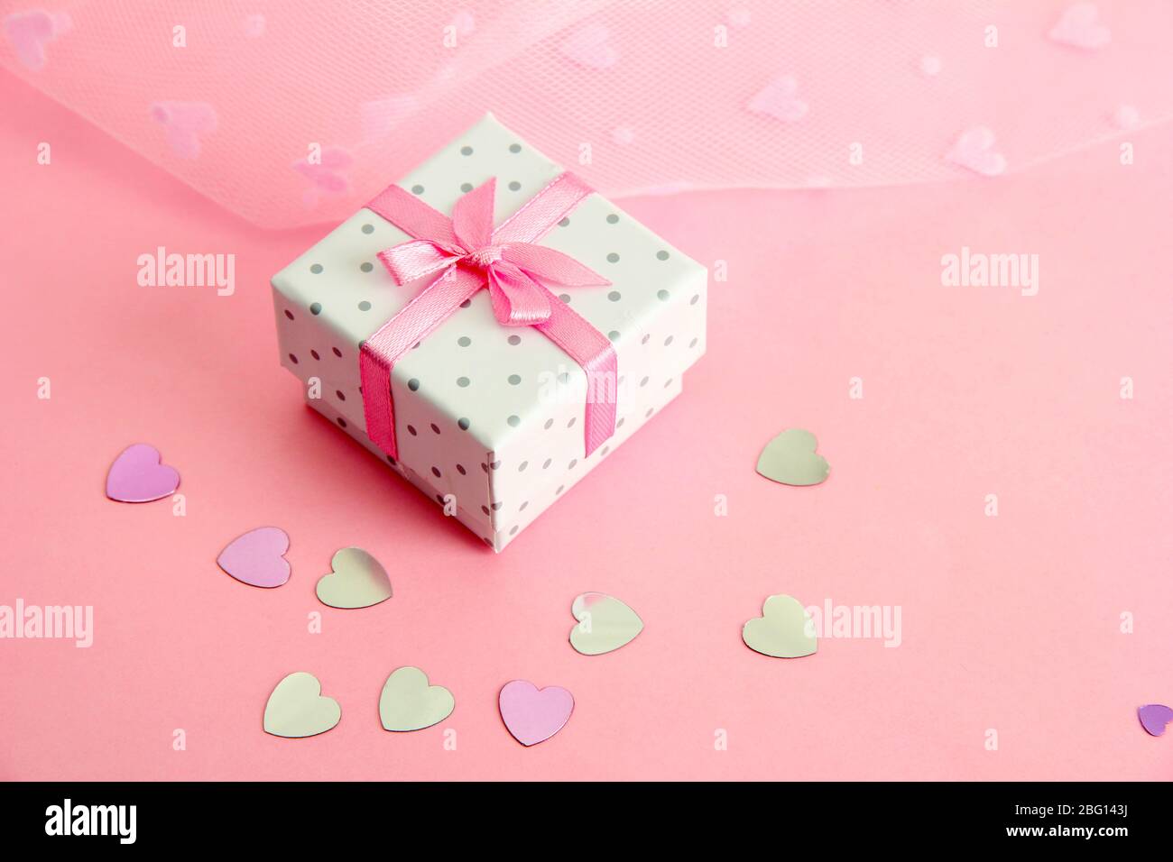 Beautiful romantic gift box on pink background Stock Photo - Alamy