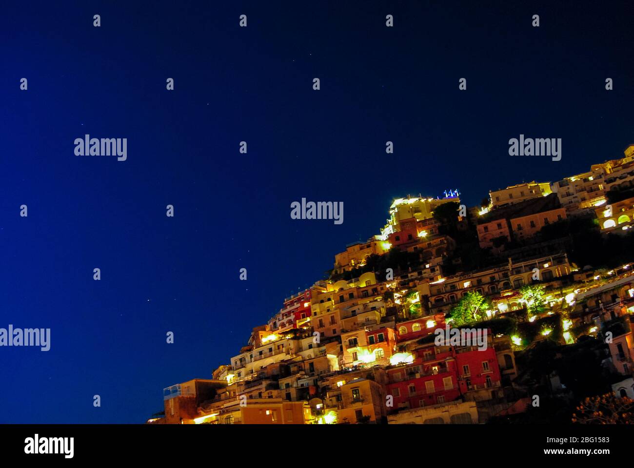 Positano lights againts the night blue sky Stock Photo - Alamy