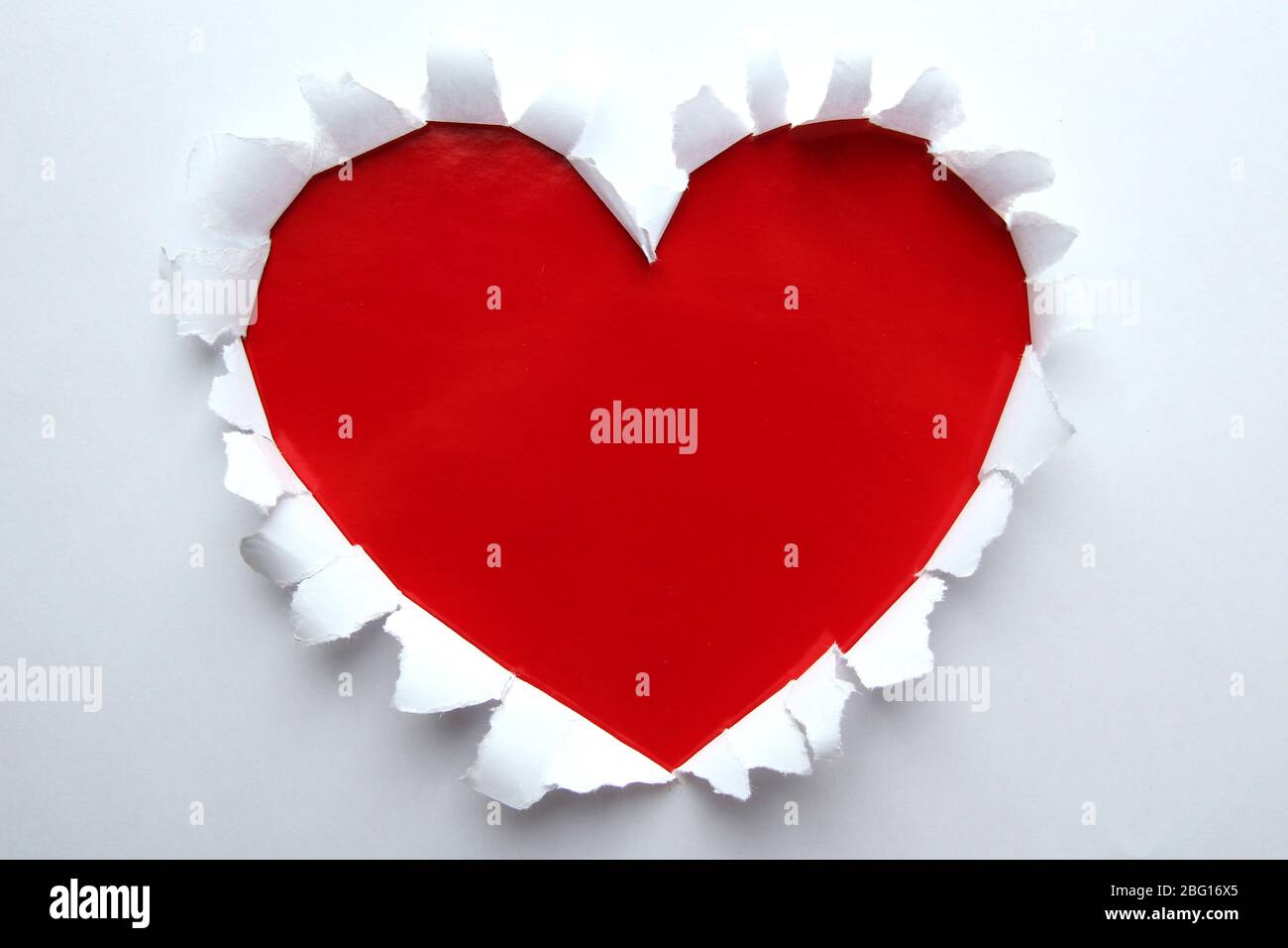 Beautiful torn paper in heart shape symbol Stock Photo - Alamy