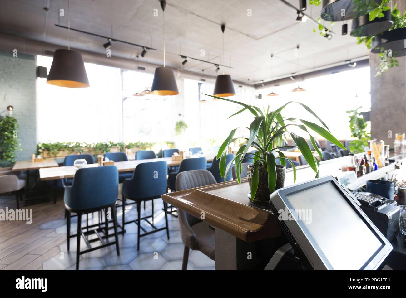 Light walls and blue furniture in stylish restaurant design Stock Photo ...