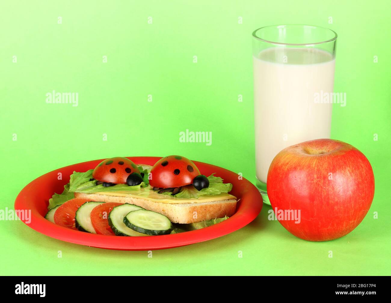 Fun food for kids on green background Stock Photo - Alamy