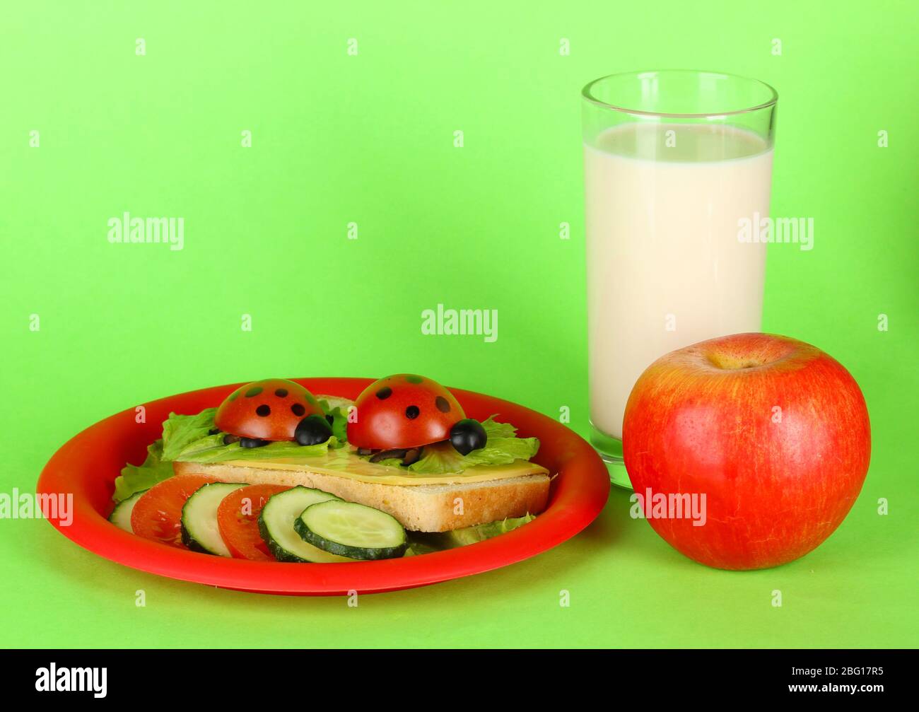 Fun food for kids on green background Stock Photo - Alamy