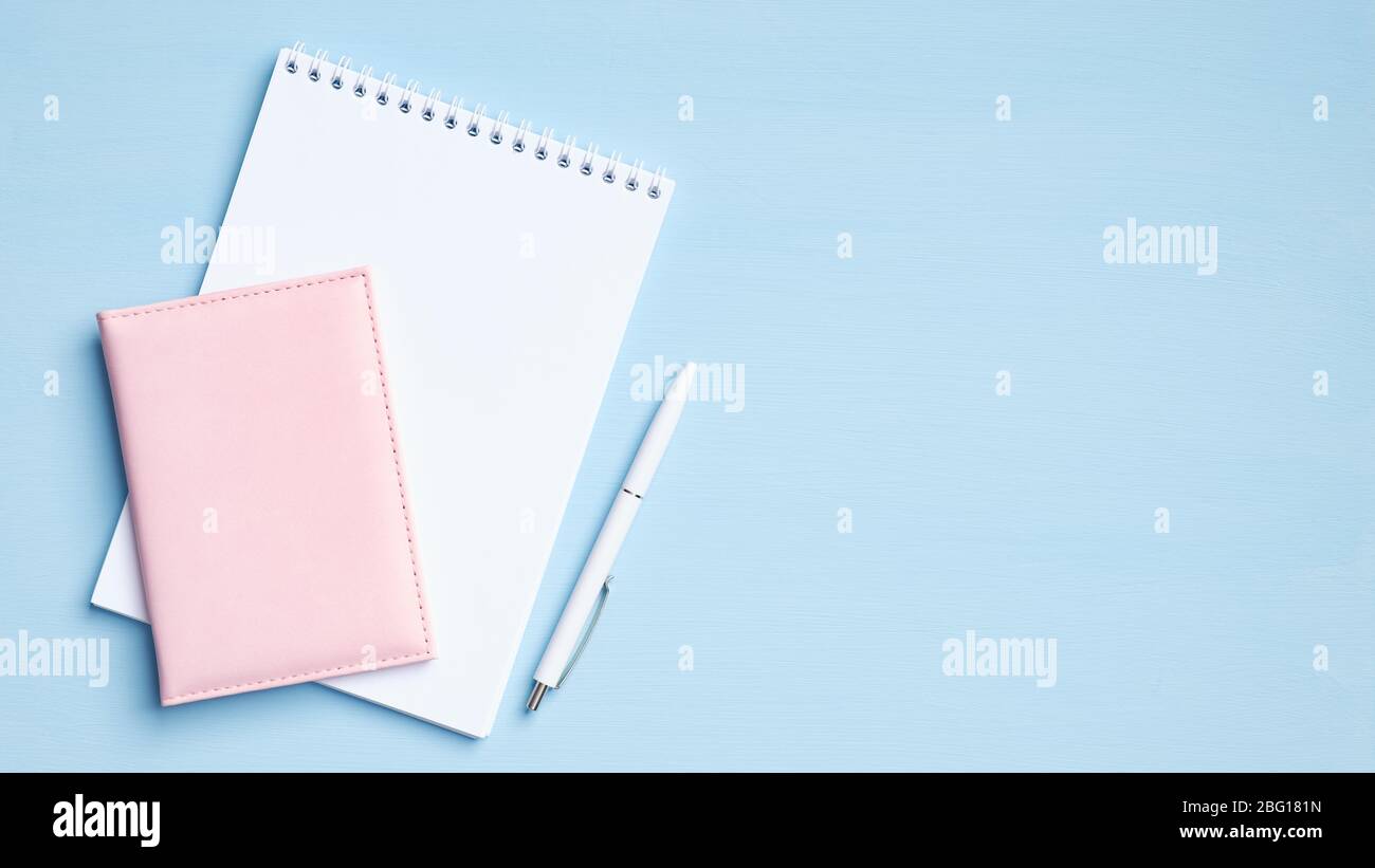 Blank notepad with pen and documents on blue background. Flat lay, top ...