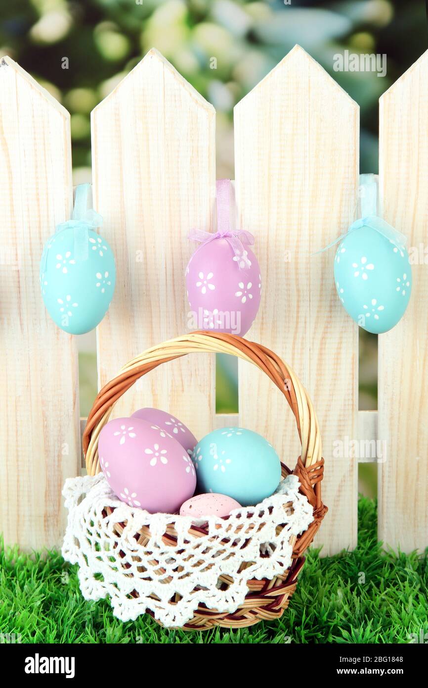 Art Easter background with eggs hanging on fence Stock Photo - Alamy
