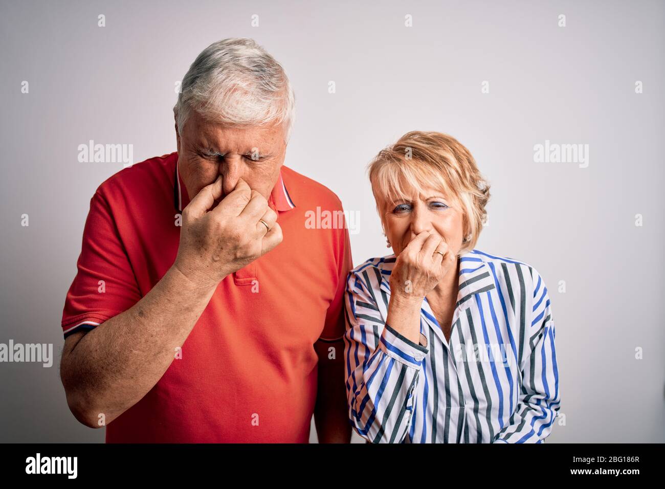 Senior beautiful couple standing together over isolated white ...