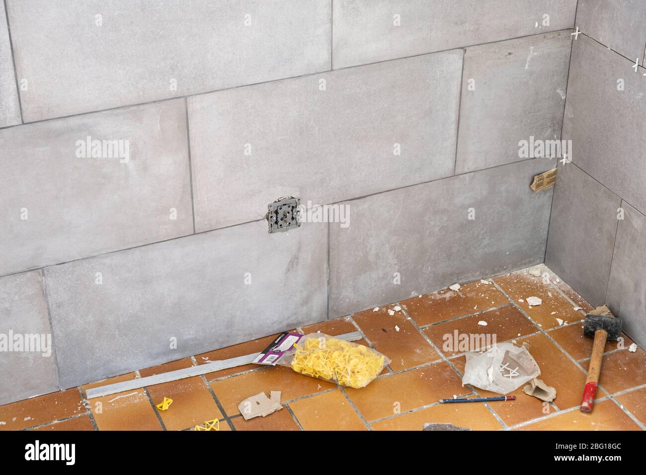 ceramic tile installation site with its tools Stock Photo - Alamy
