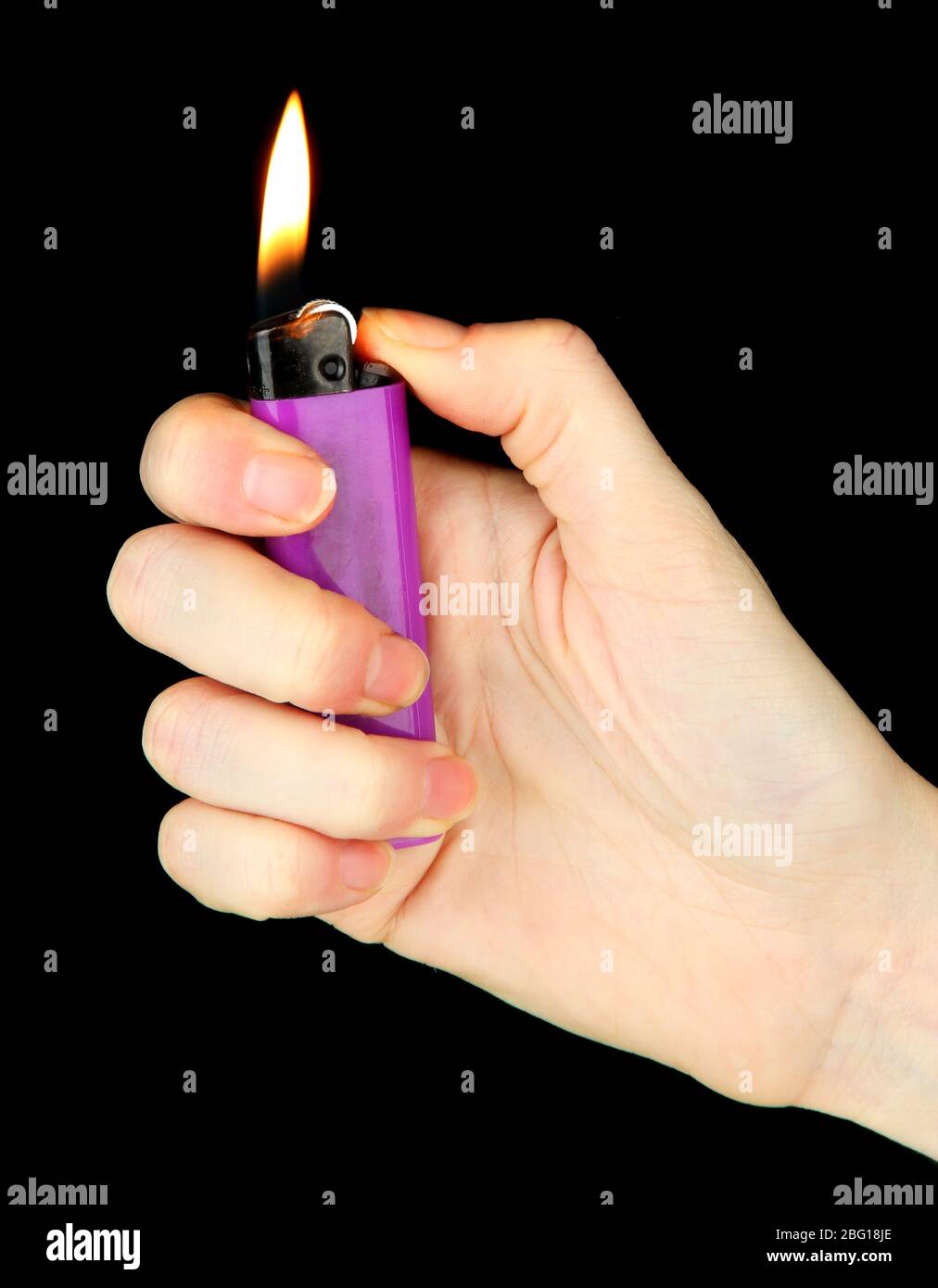 Burning lighter in female hand, isolated on black Stock Photo - Alamy